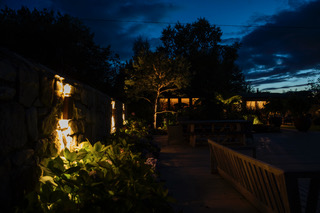 The Fold Light giving a low level lighting against the stone wall and ...